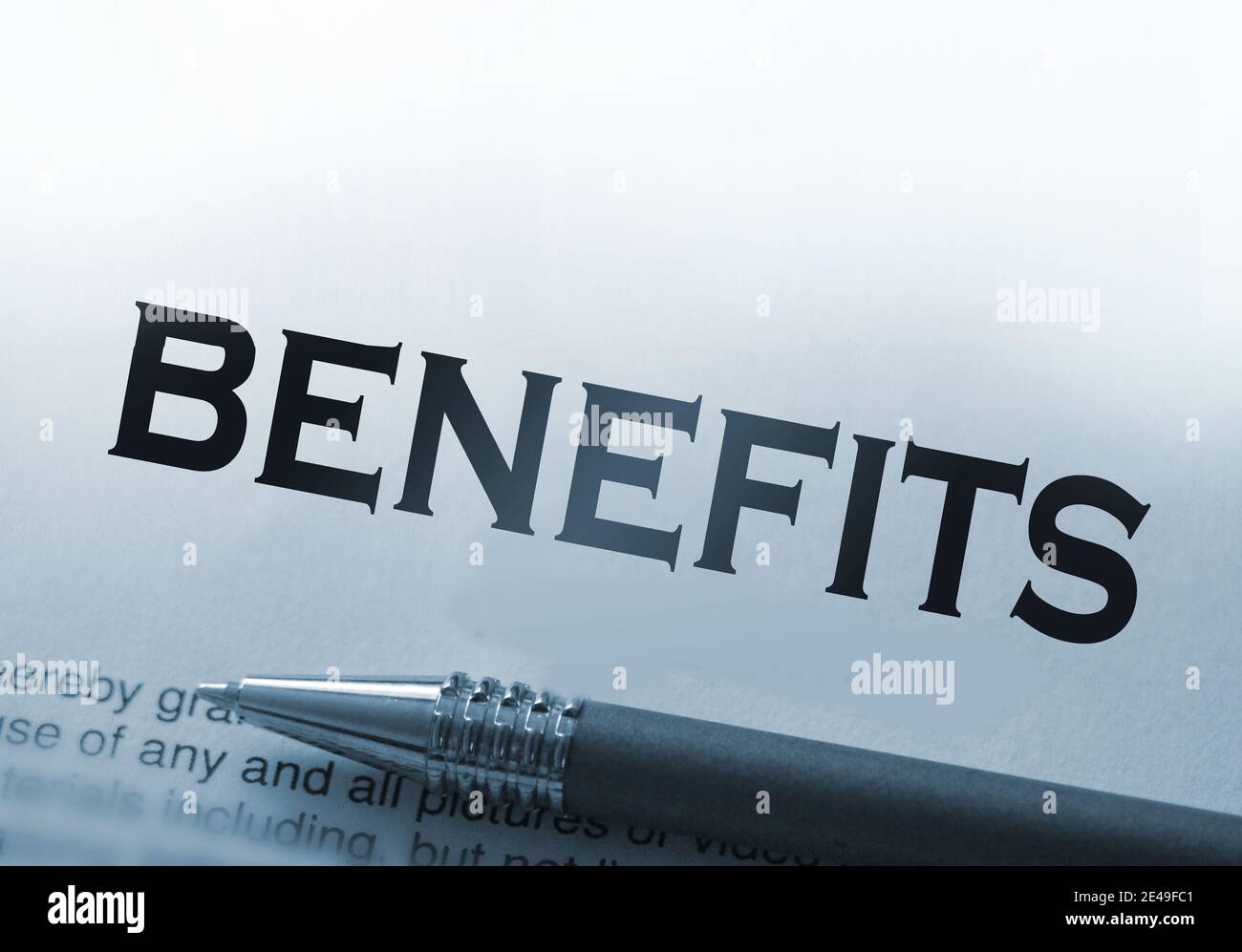 Benefits word printed on page with pen. Insurance or retirement payment ...