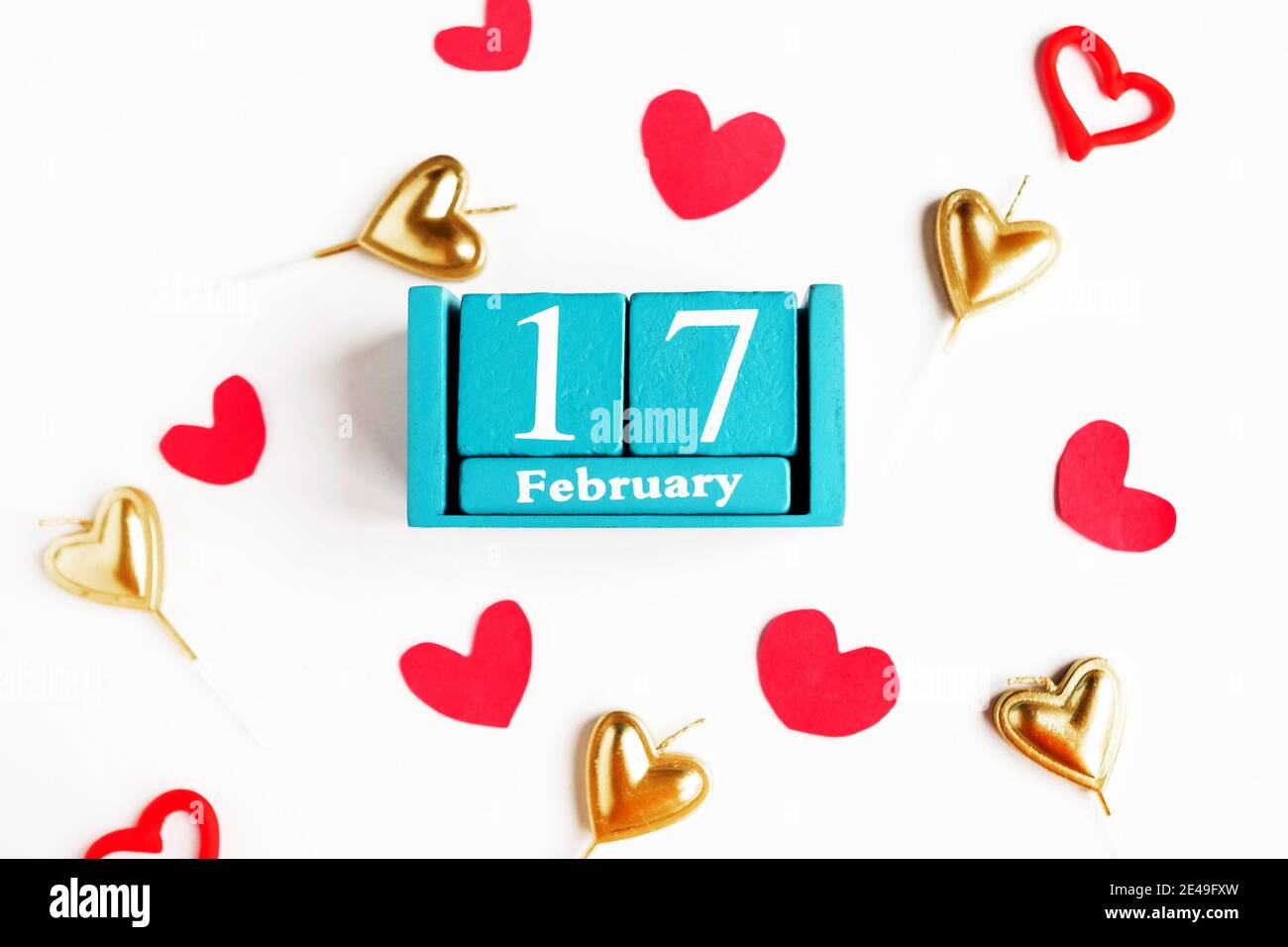 February 17. Blue cube calendar with month and date and decorative ...