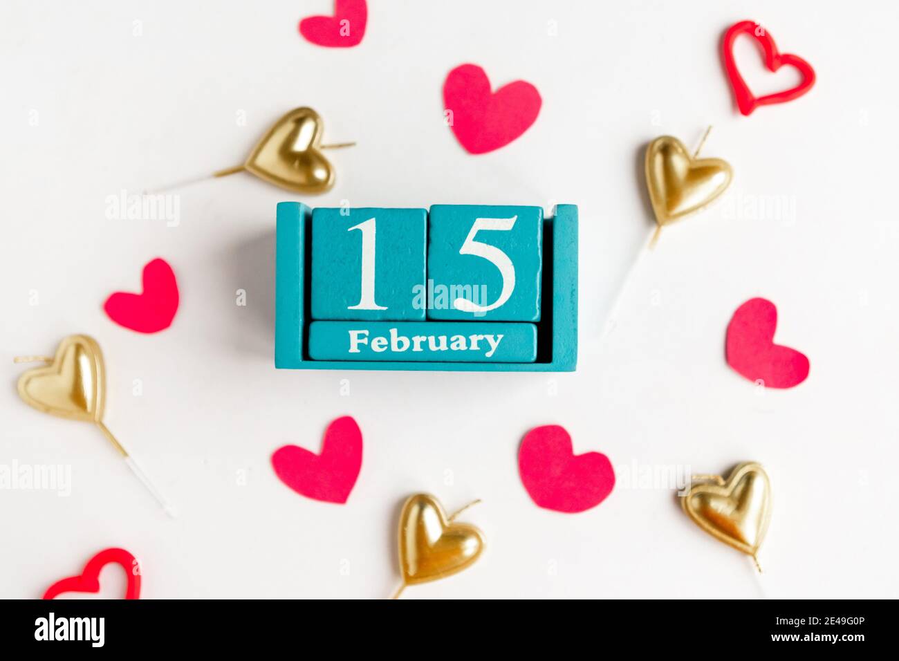 February 15. Blue cube calendar with month and date and decorative ...