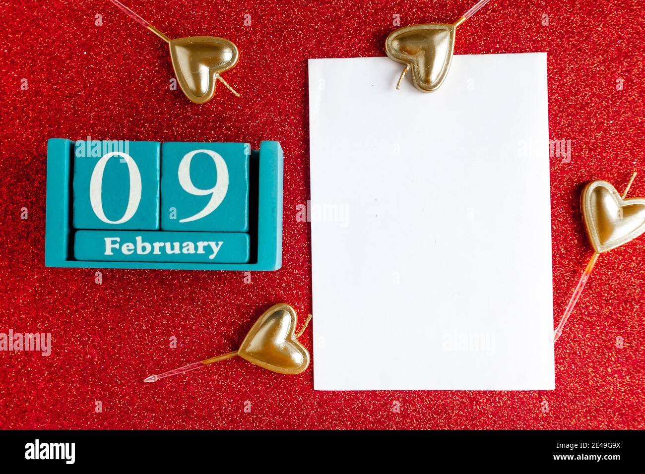 February 9. Blue cube calendar with month and date and white mockup ...