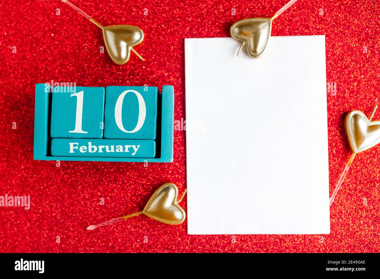 February 10. Blue cube calendar with month and date and white mockup ...