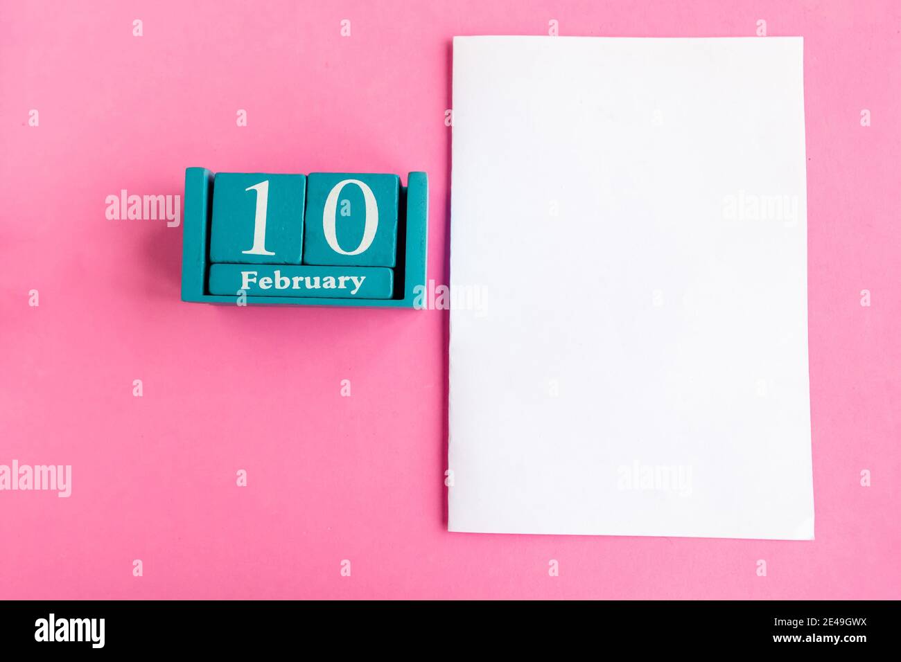 February 10. Blue cube calendar with month and date and white mockup ...