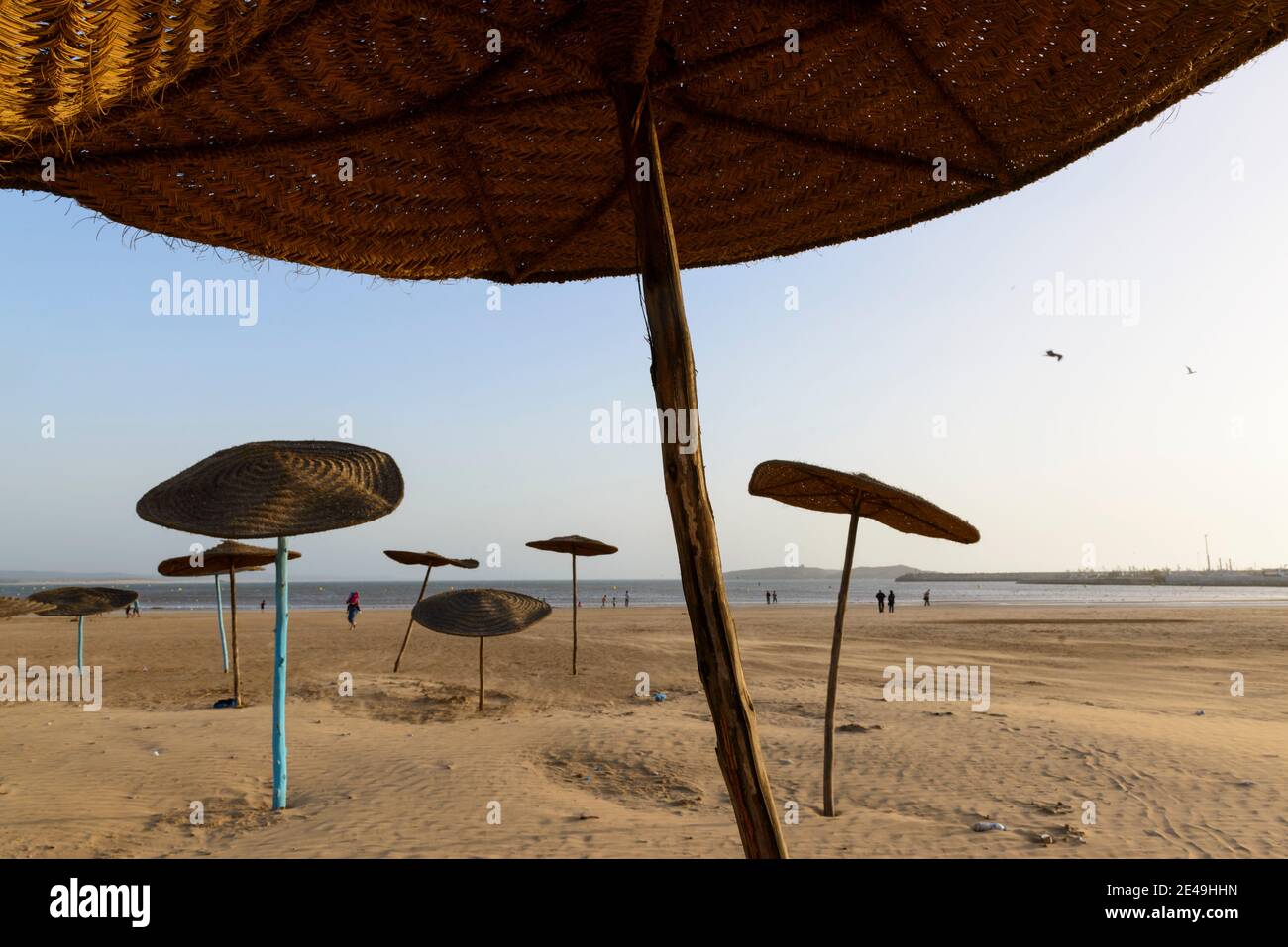 Parasols on the beach during stormy weather. Essaouira, Morocco Stock ...