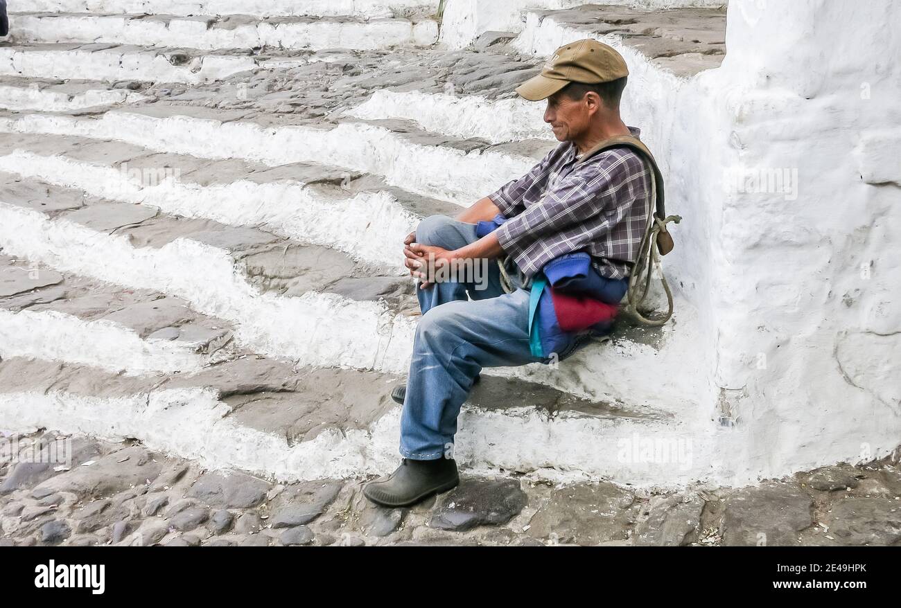 Mayan man resting at the on the steps of the stairst of ...