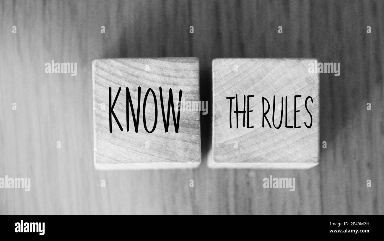Know the rules word on wooden blocks isolated on dark grey background ...