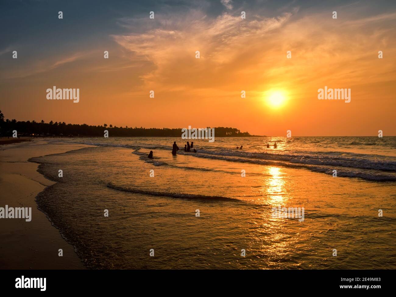 Evening at beach with sun reflection on water. This beach is known as ...