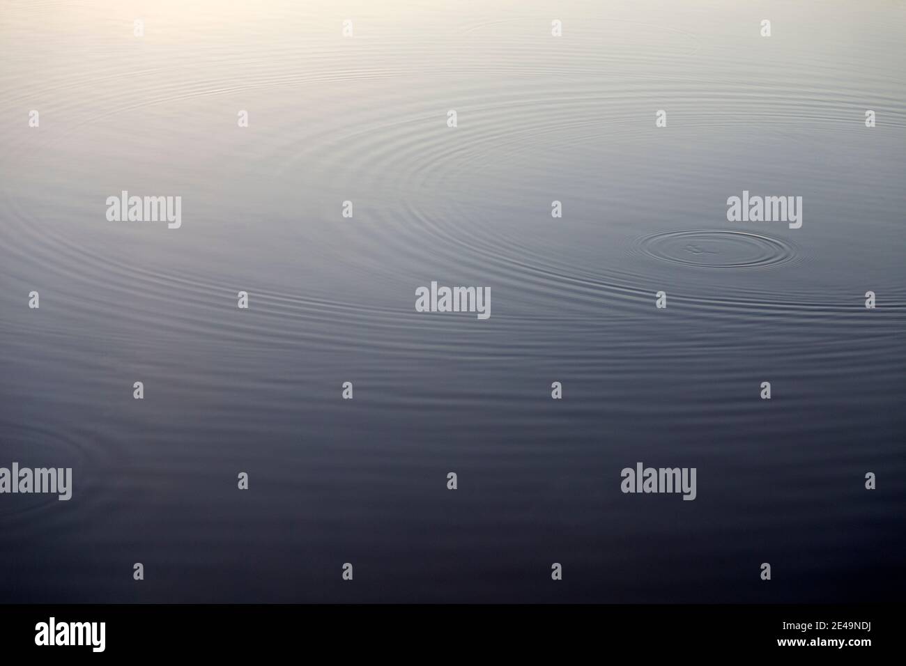 Ripples in deep blue water like circles. This image may be used as a ...