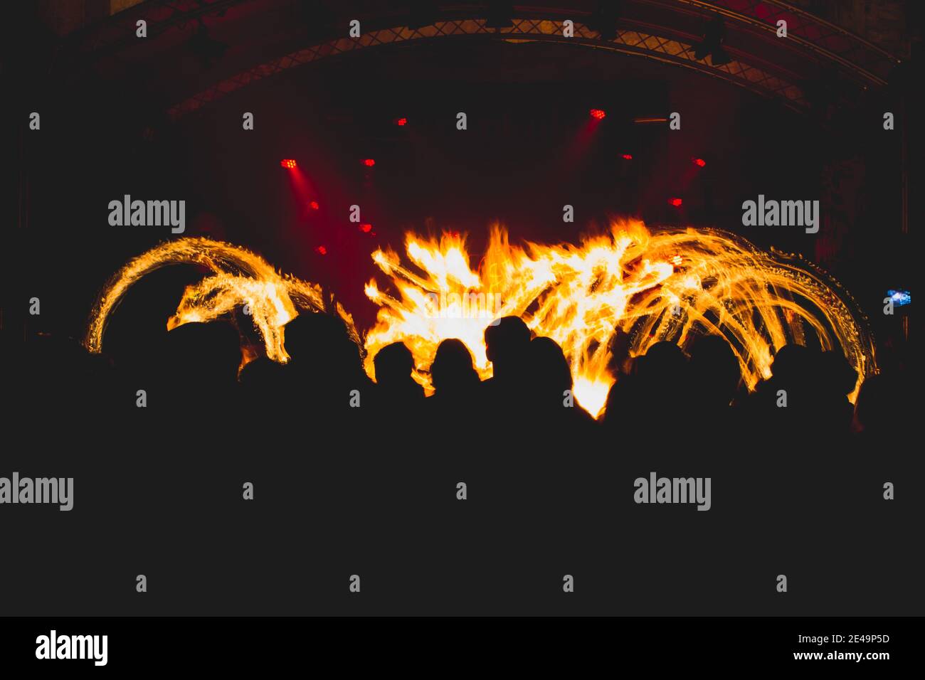 Stage performance of Fire Artists with lightshow and audience in front ...
