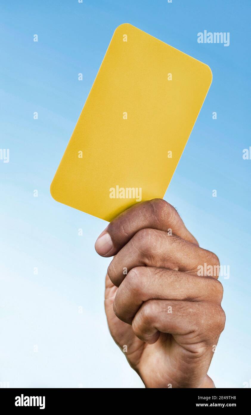 Referee holding up yellow card hi-res stock photography and images - Alamy