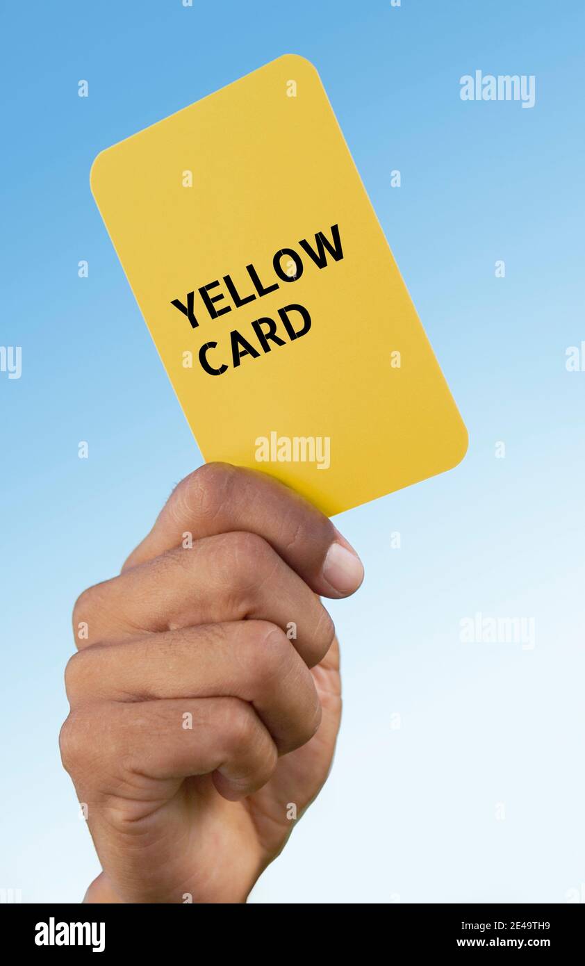 Close up shot of Referee Yellow Card Stock Photo - Alamy