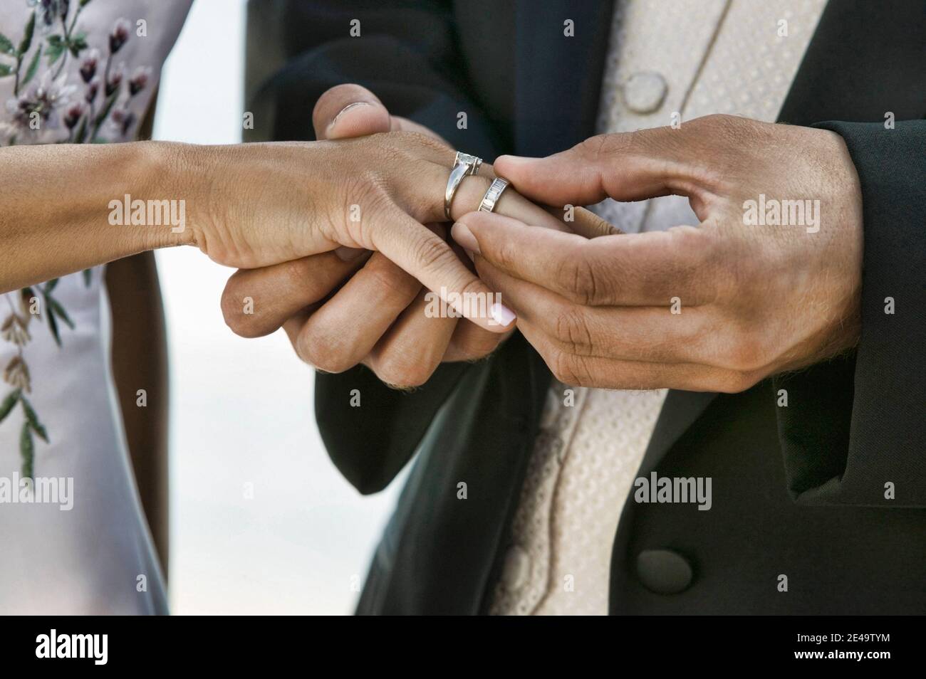 Happy male putting wedding ring hi-res stock photography and images - Alamy