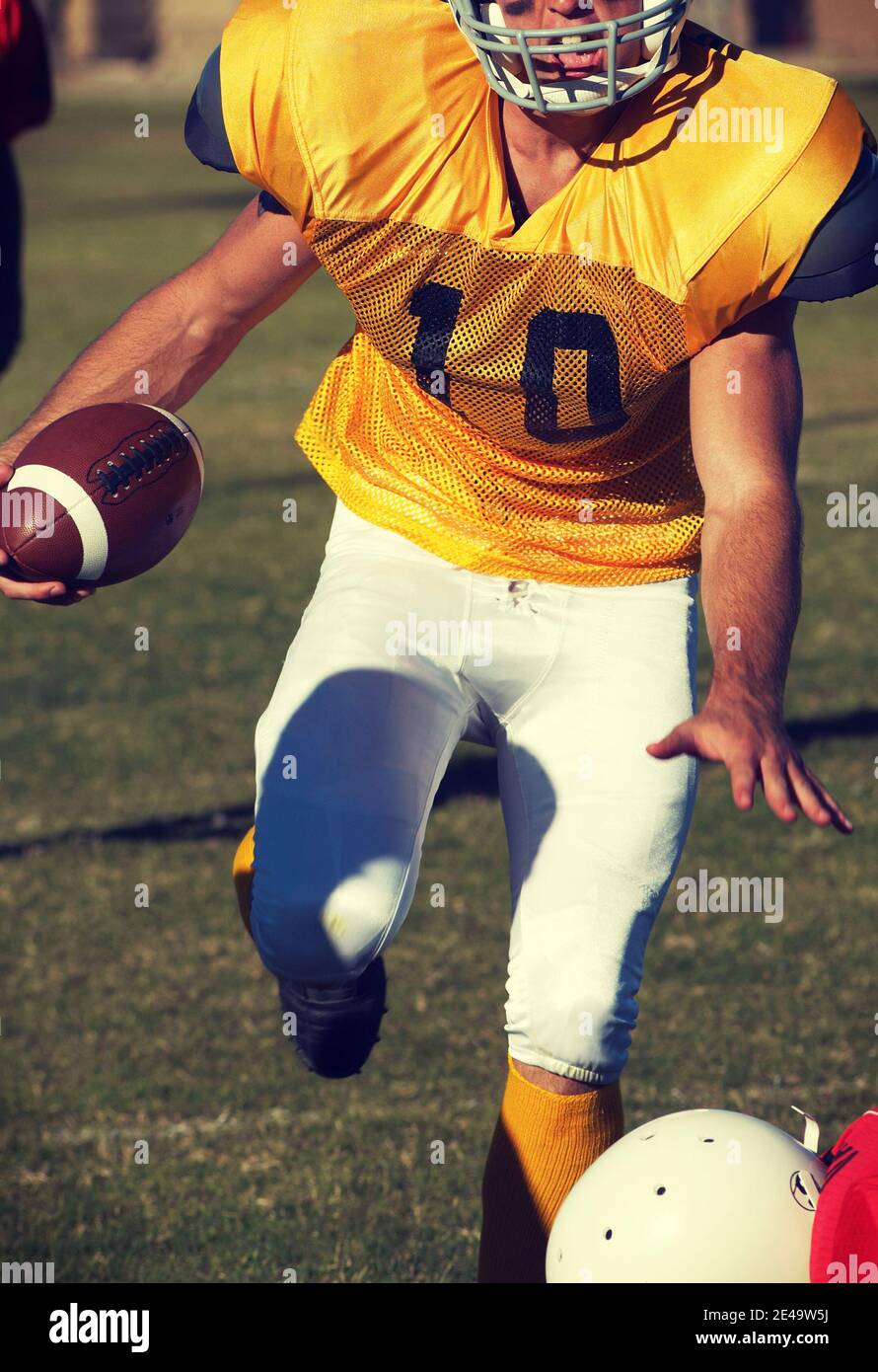 Photo of Running American Football Player Stock Photo - Alamy