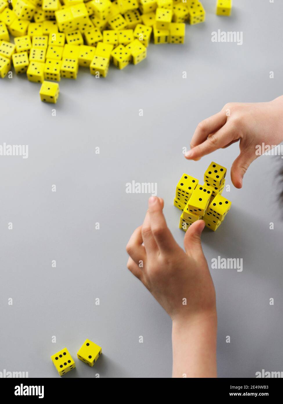 Little boy Playing with Dice at home Stock Photo - Alamy