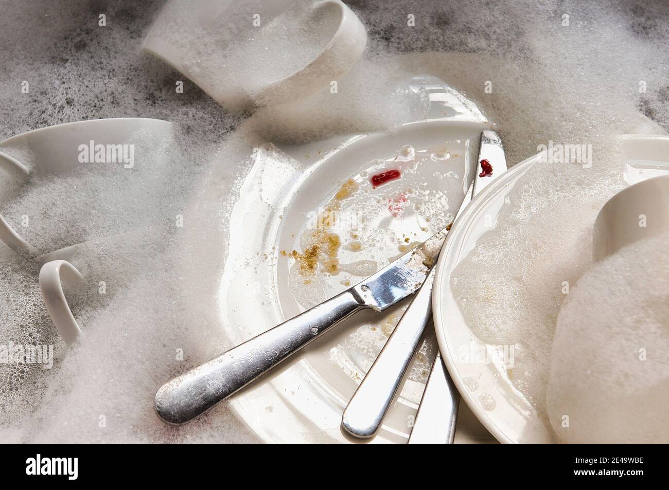 Stack of dirty dishes and silverware in sink Stock Photo - Alamy