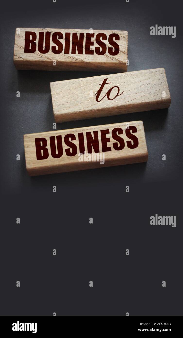 Wooden blocks with words Business to Business. B2B marketing concept ...
