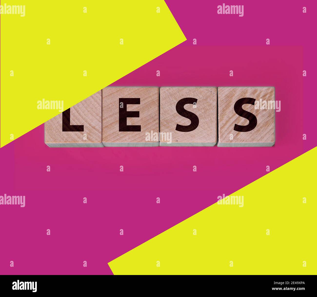 Less word on wooden cubic blocks with letters. Spend less or cut costs ...