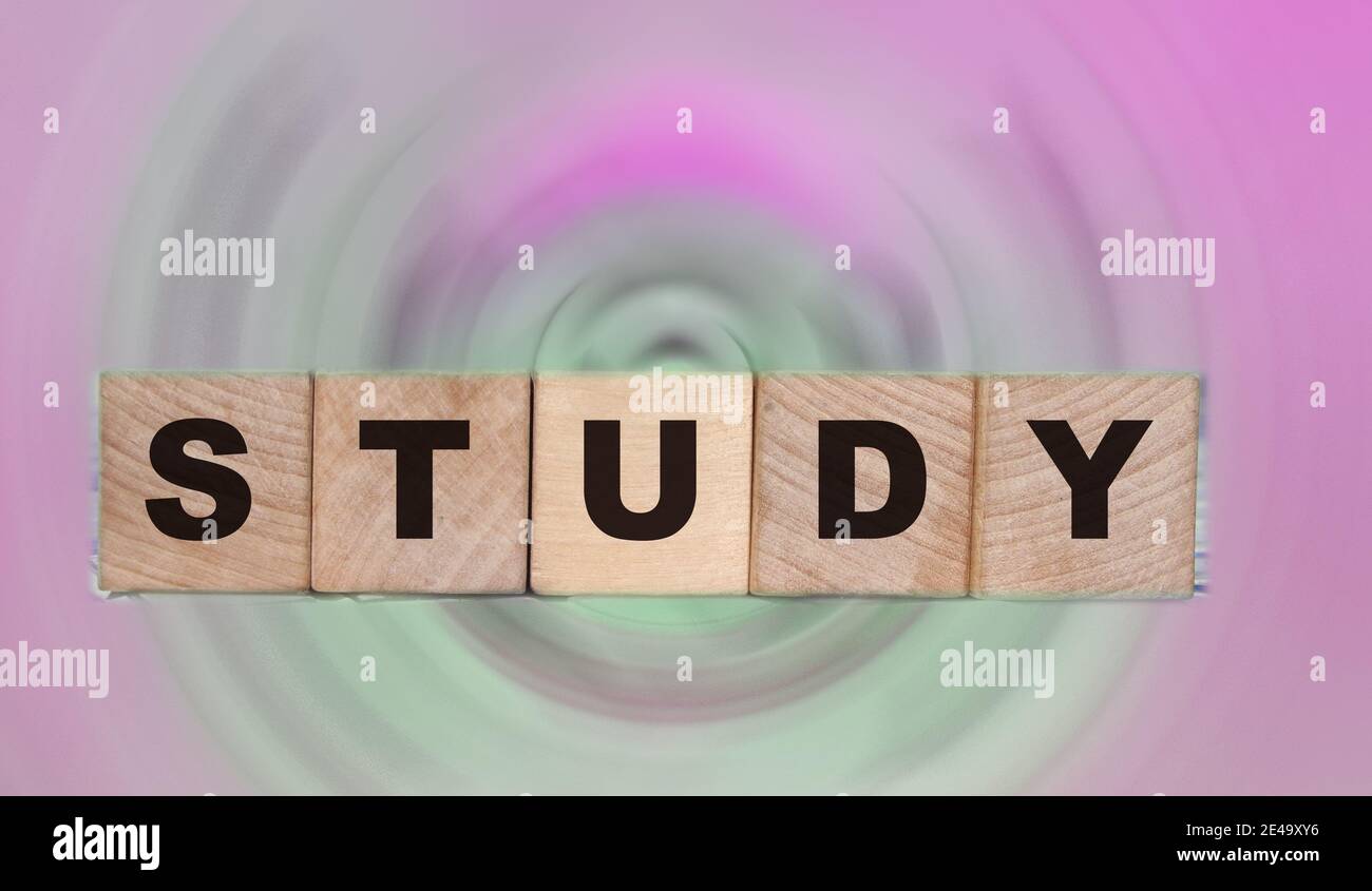 Study word on wooden blocks over ocean beach landscape. Learning ...