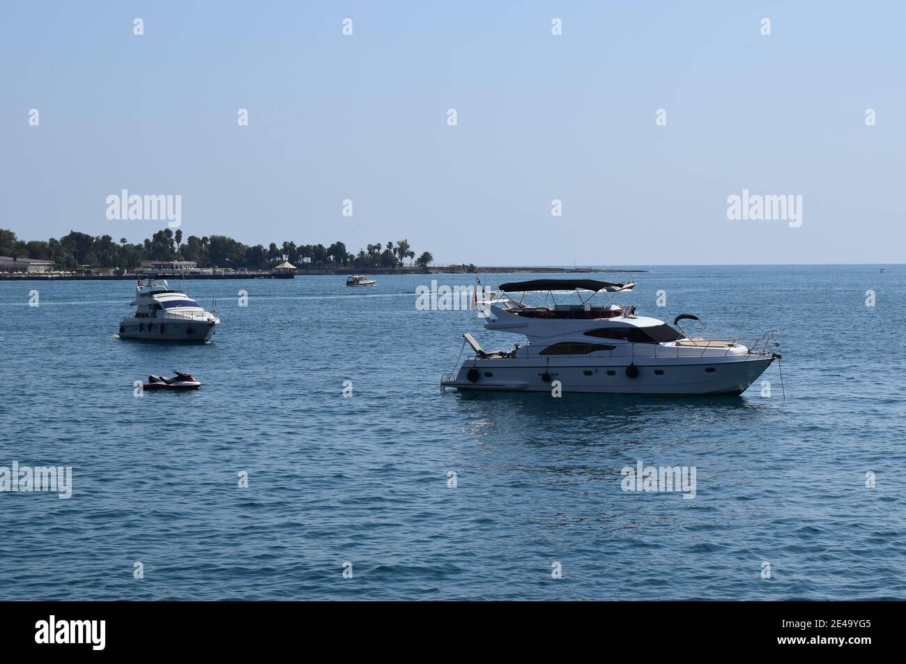 Jetski and yachts on the sea. Clear sea blue sky. Motor transport in ...