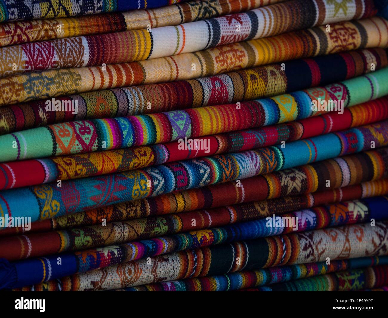 Closeup view of textile pile colorful traditional andean indigenous ...