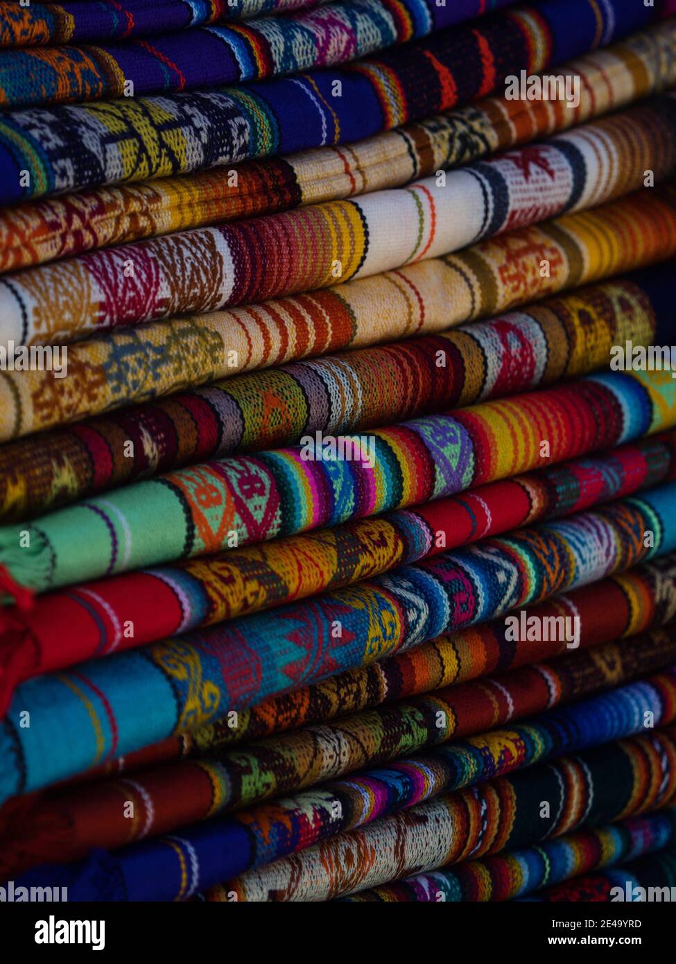 Closeup view of textile pile colorful traditional andean indigenous ...