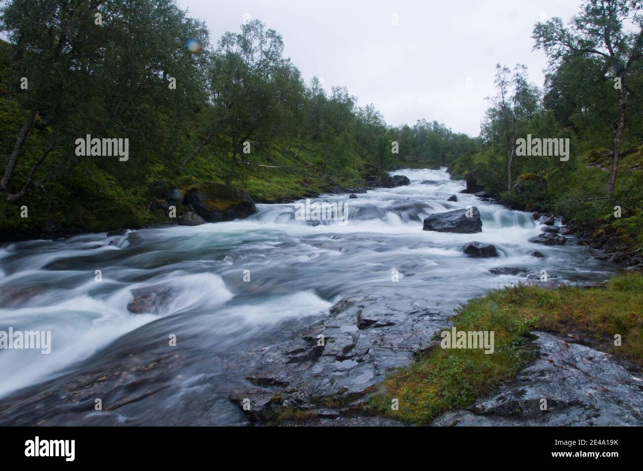 Vibrant scenery of a river flowing over rocks with long exposure Stock ...