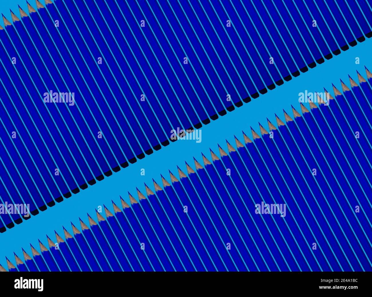 Pattern of dark blue pencils at blue background Stock Photo - Alamy