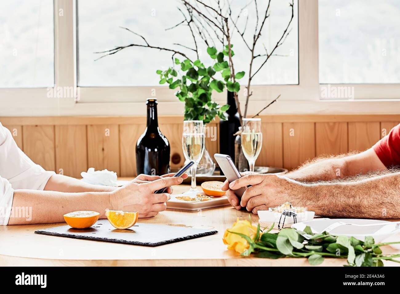 Texting at dinner table hi-res stock photography and images - Alamy