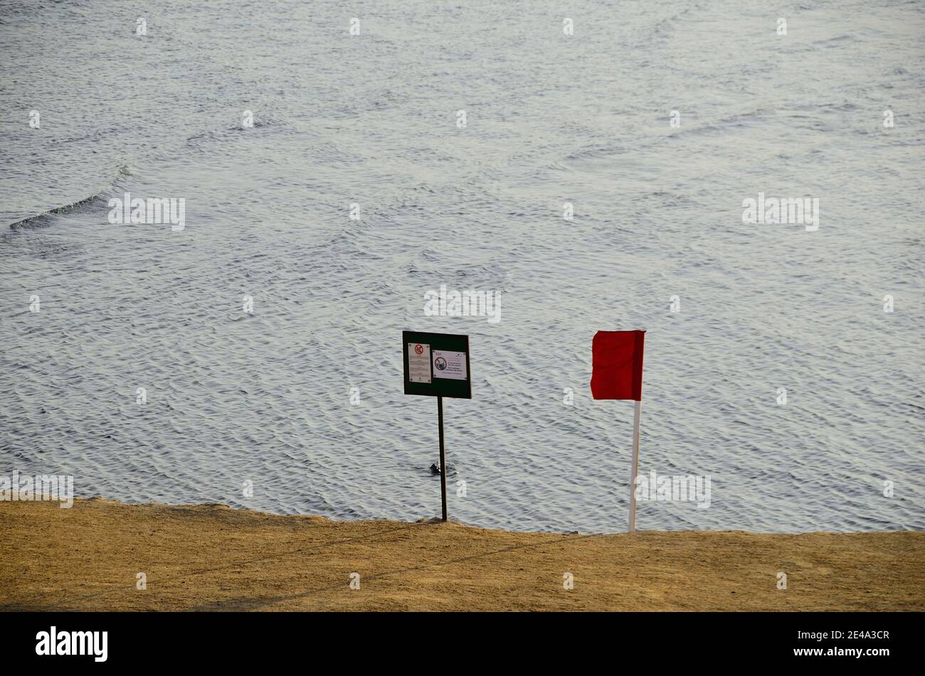 warning signs and notes on the sandy beach and sea Stock Photo - Alamy