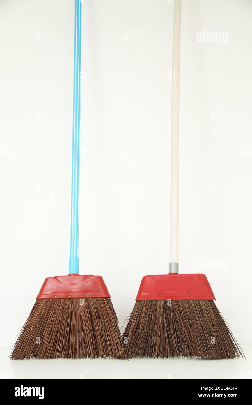 Piassava, piaçava broom with long wooden handle isolated on white ...