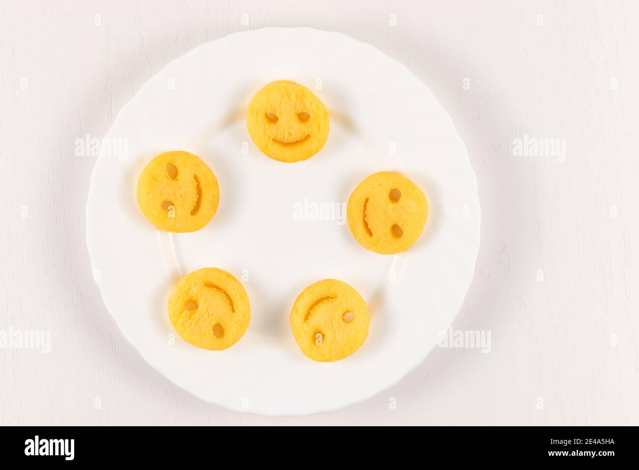 fresh potato hot emoticons fries on white plate close-up on white ...