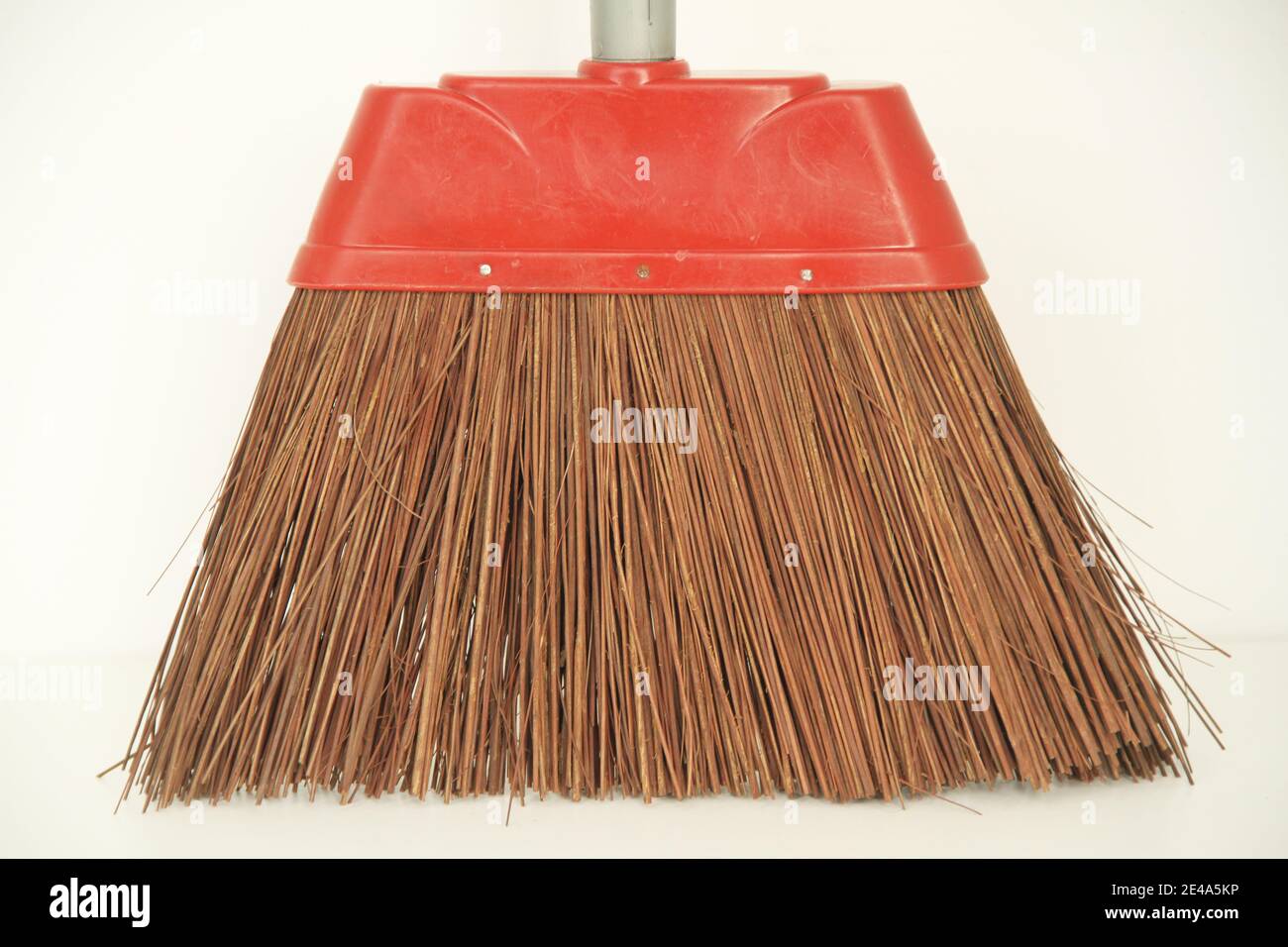 Piassava, piaçava broom with long wooden handle isolated on white ...