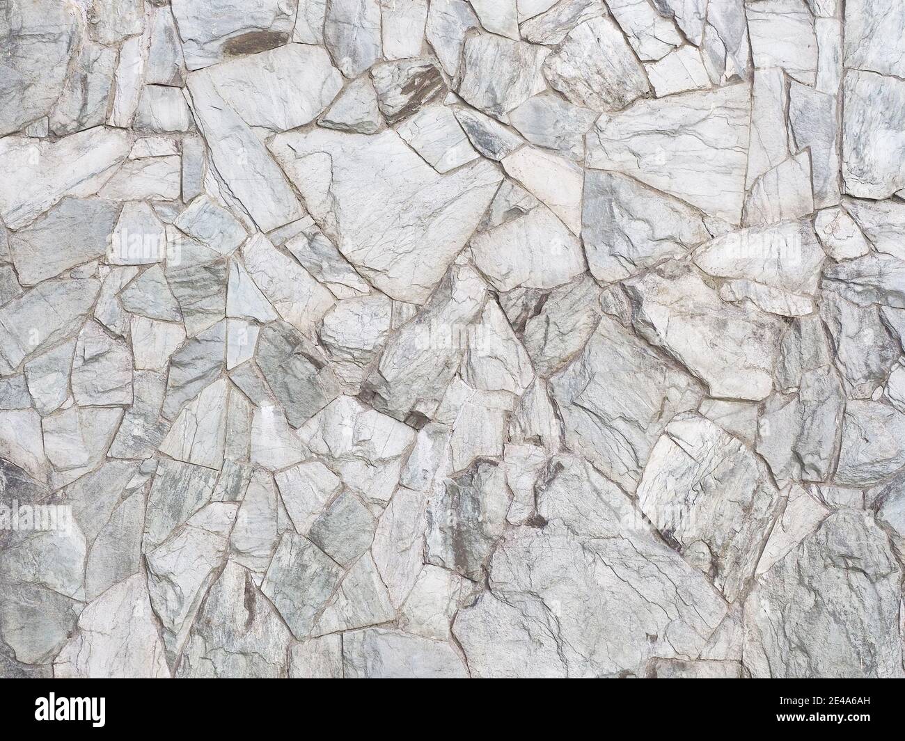 Wall clad with gray granite shards of different sizes Stock Photo - Alamy