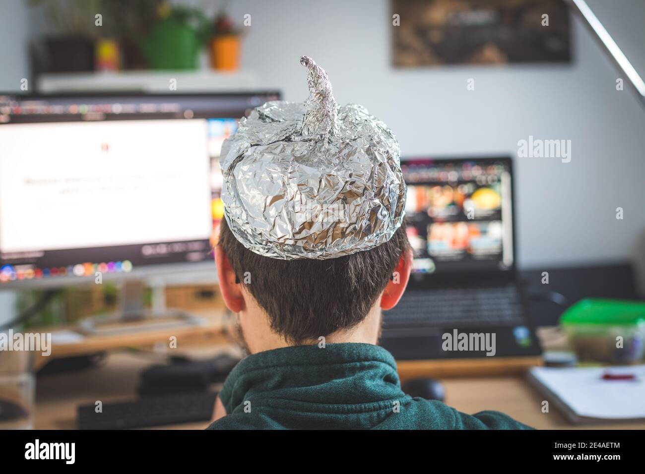 Young man is wearing aluminum cap, conspiracy theory concept Stock ...