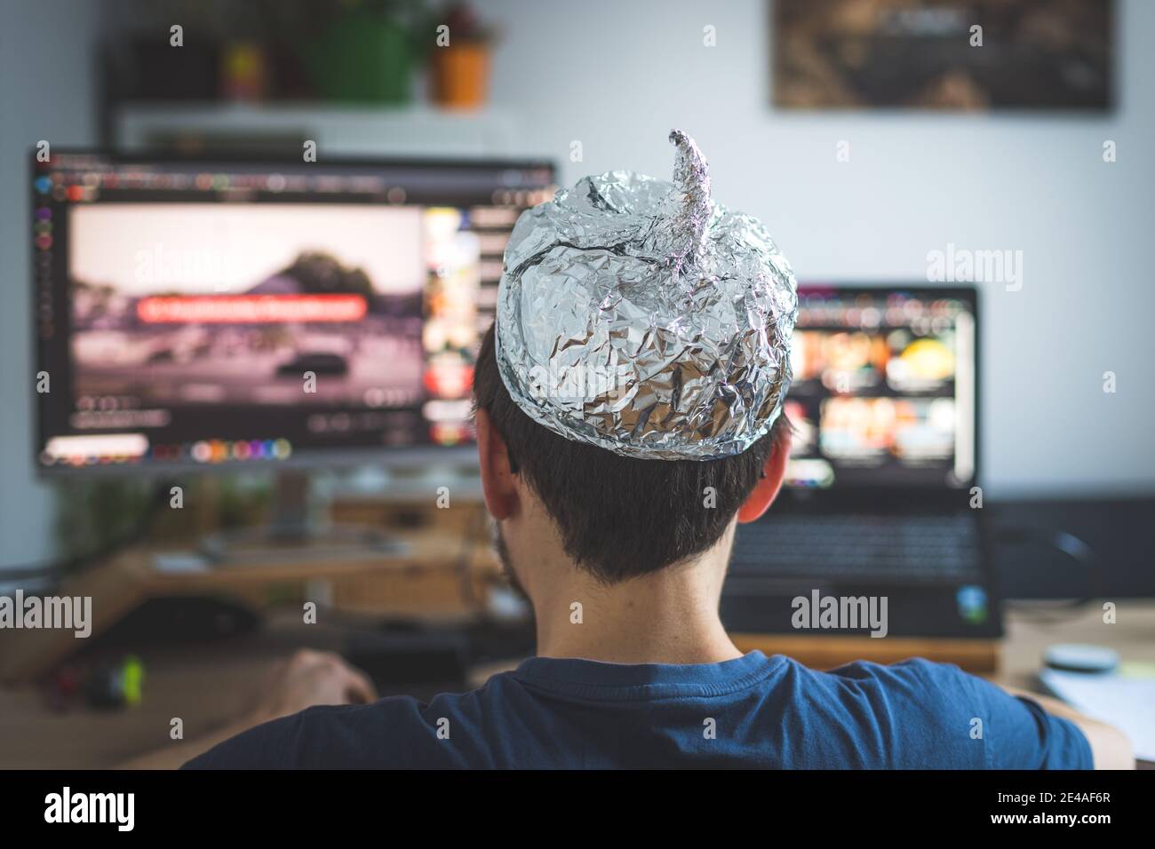 Young man is wearing aluminum cap, conspiracy theory concept Stock ...