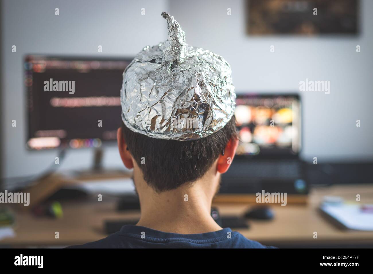 Young man is wearing aluminum cap, conspiracy theory concept Stock ...