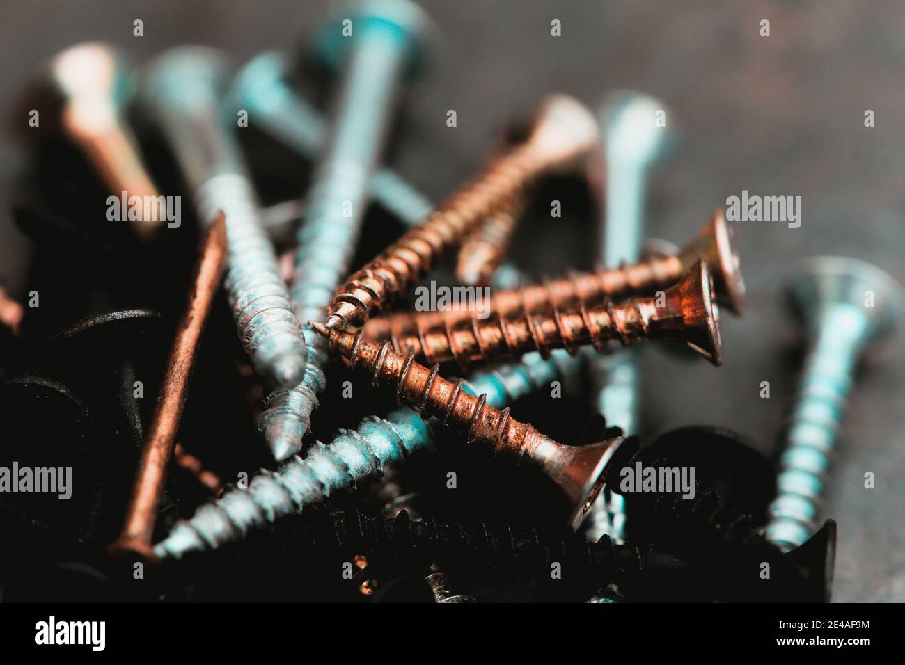 Different Kind of Screws on a table in a workshop Stock Photo - Alamy