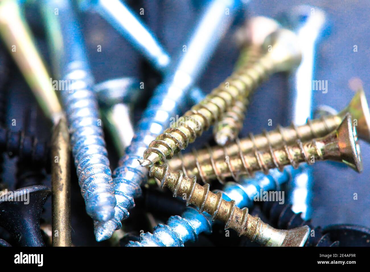 Different Kind of Screws on a table in a workshop Stock Photo - Alamy