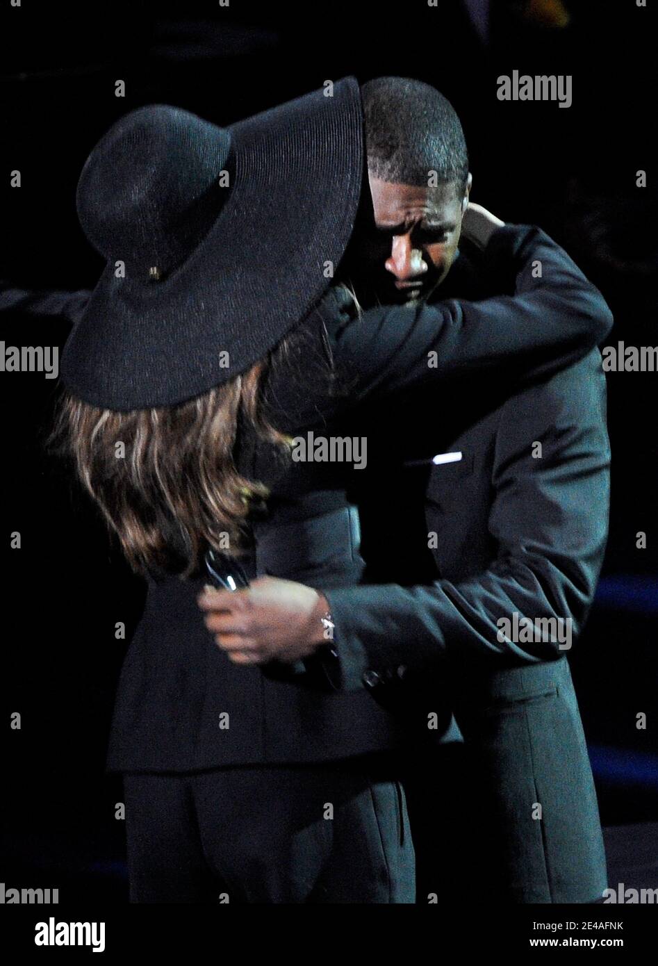 Singer Usher hugs LaToya Jackson during the memorial service for ...