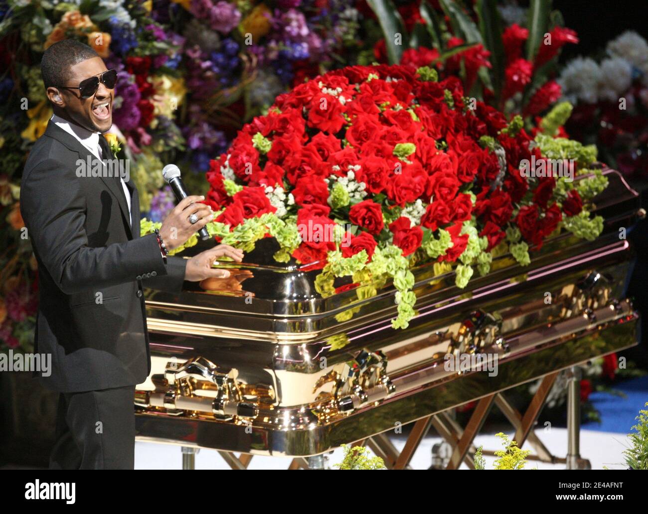 Singer Usher performs during the memorial service the memorial service ...