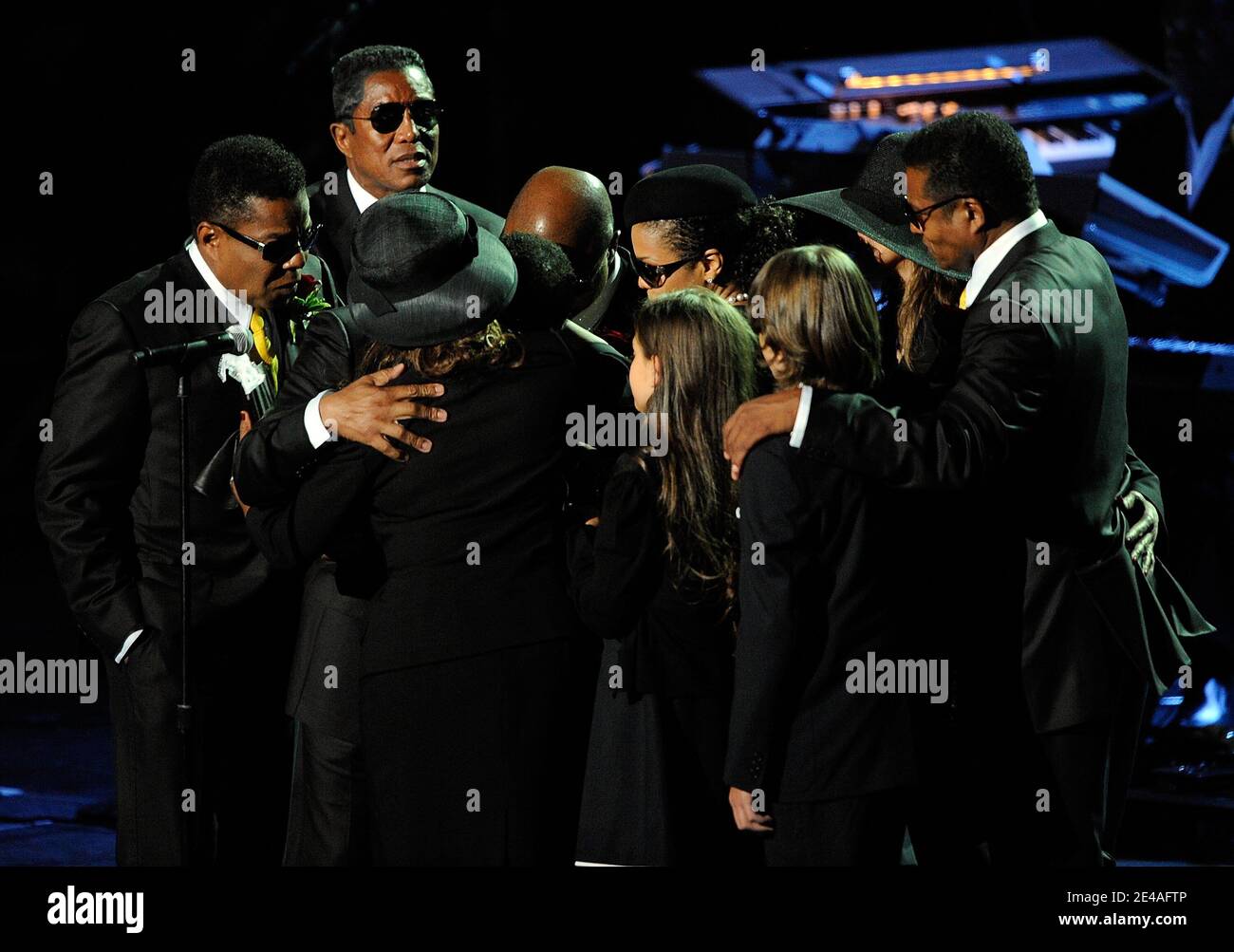 The Jackson family hugs onstage during the memorial service for Michael ...