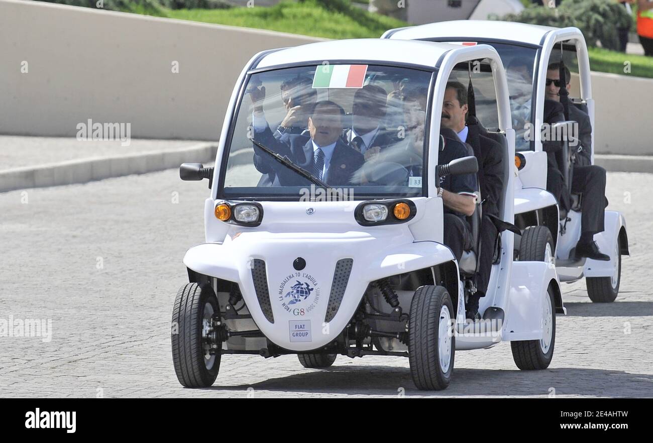 Italian Prime Minister Silvio Berlusconi arrives in a electric car for ...