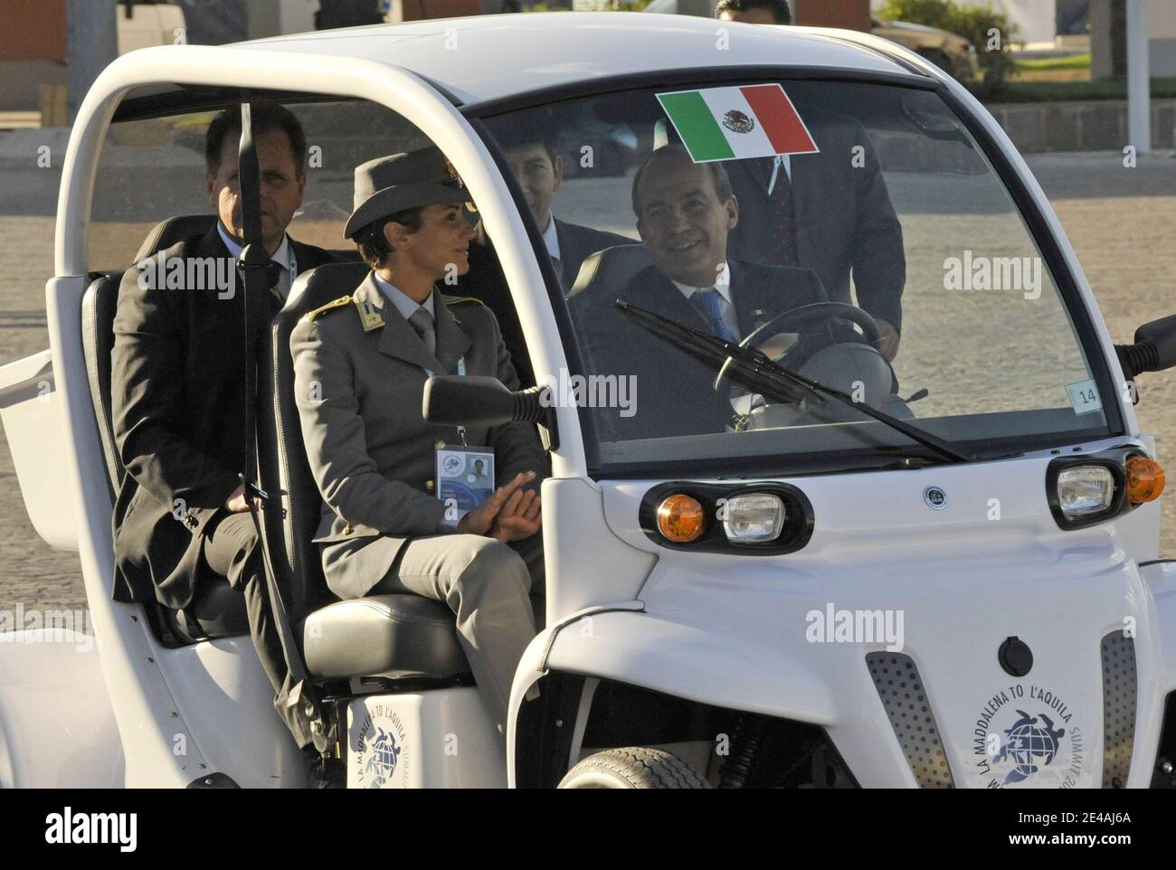 Mexican President Felipe Calderon drives a small electric vehicle at ...