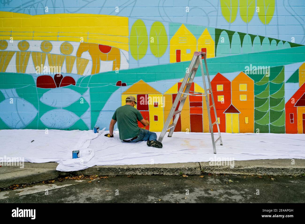 Artist Michael Hepher painting 'All Kinds of Beauty ' mural downtown ...