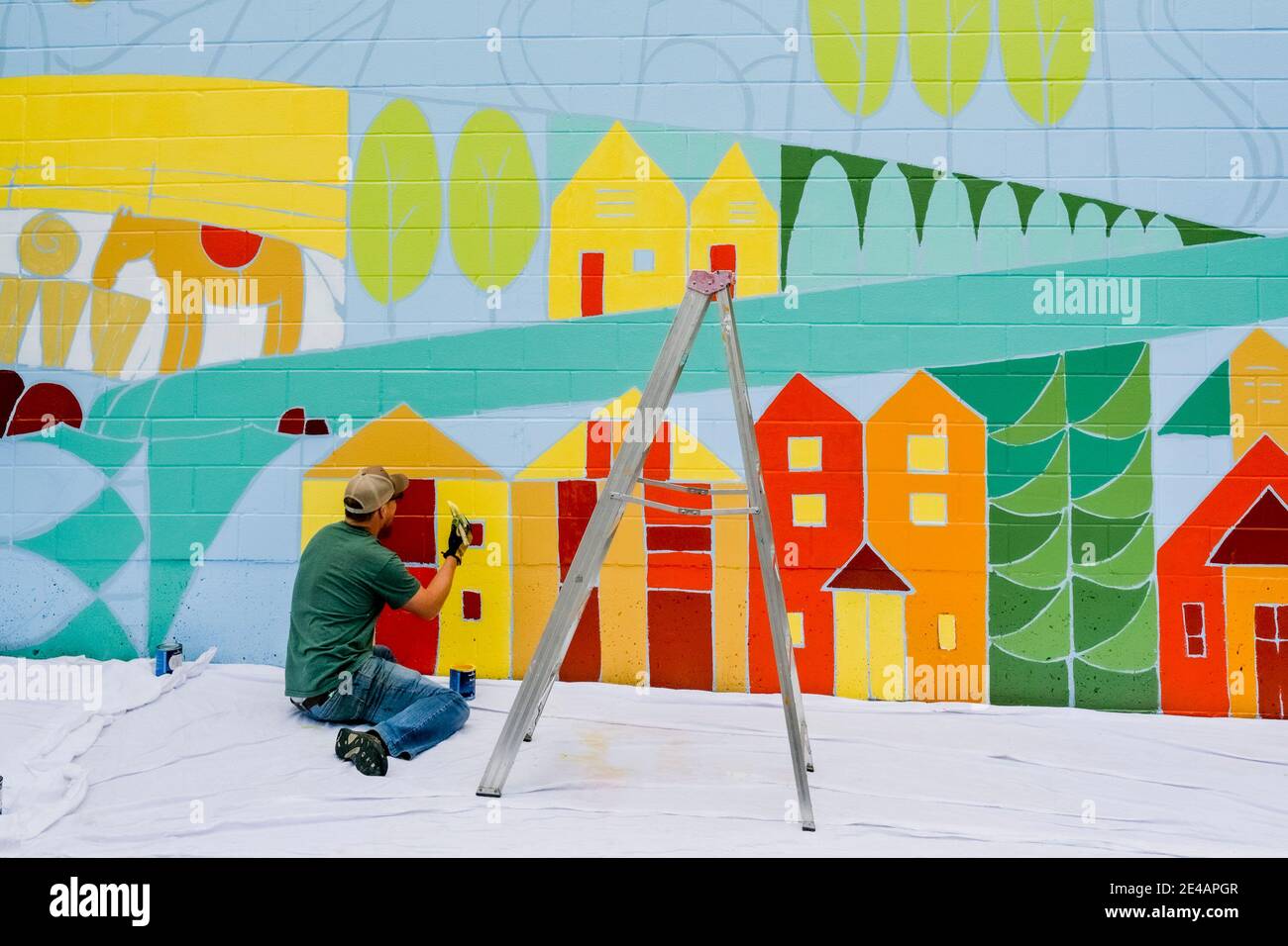 Artist Michael Hepher painting 'All Kinds of Beauty ' mural downtown ...