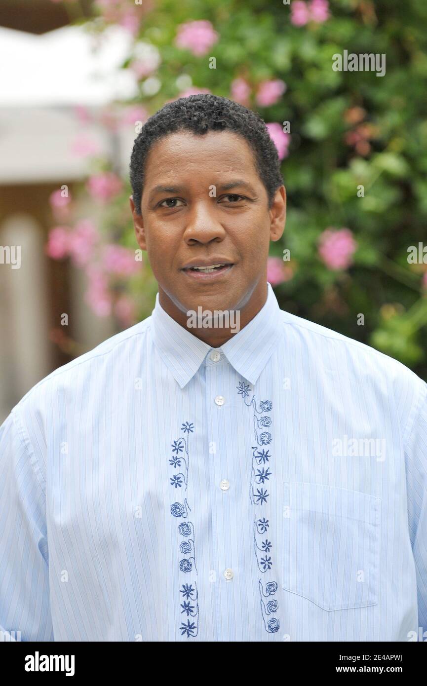US actor Denzel Washington poses for a photocall to present his movie ...
