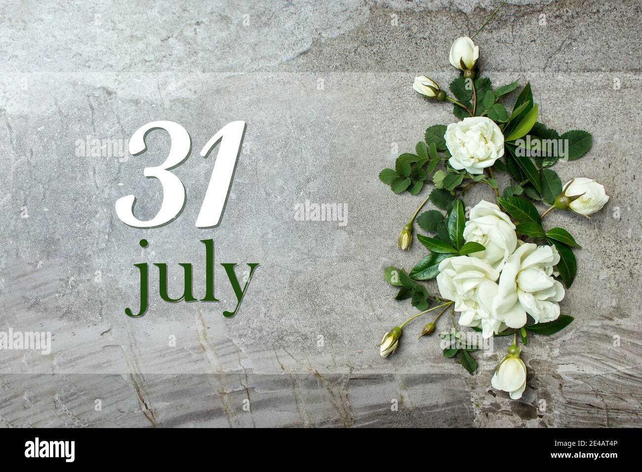 July 31st . Day 31 of month, Calendar date. Stylish roses flat lay ...