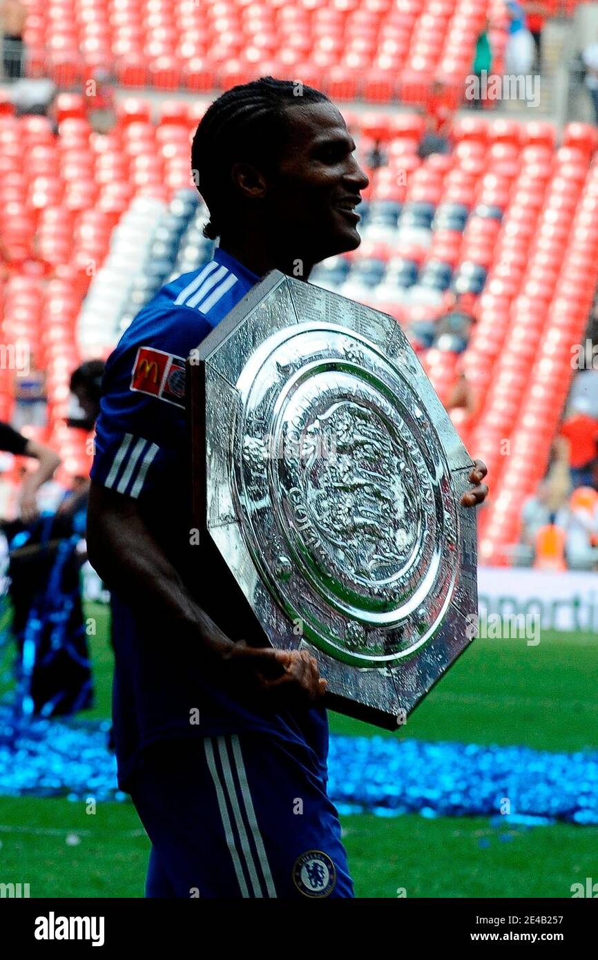 Chelsea's Florent Malouda celebrates with the Community Shield trophy ...