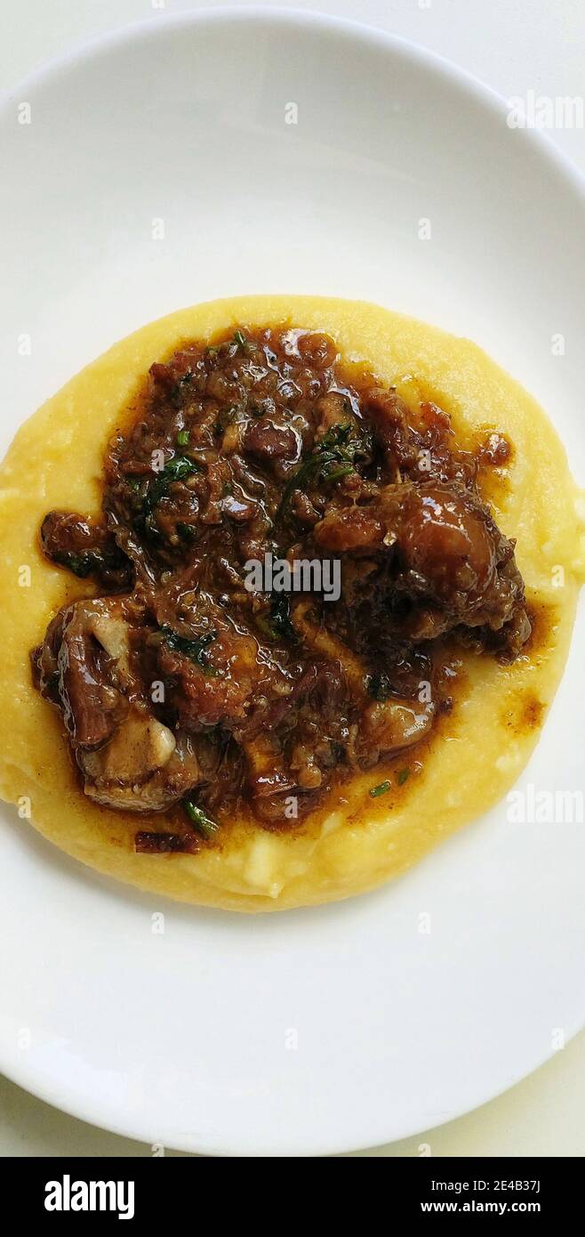 Traditional brazilian dish, Corn meal with oxtail stew, rabada with ...