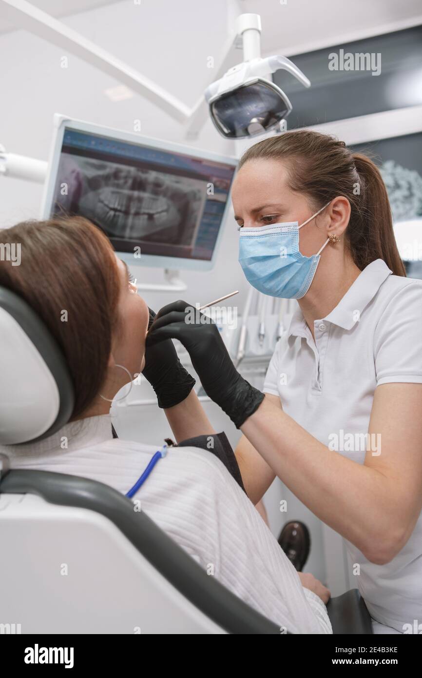 Vertical shot dentist gloves hi-res stock photography and images - Alamy