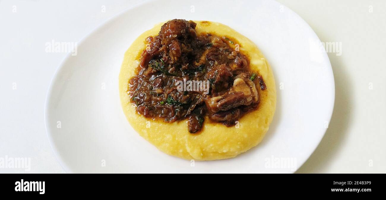 Traditional brazilian dish, Corn meal with oxtail stew, rabada with ...